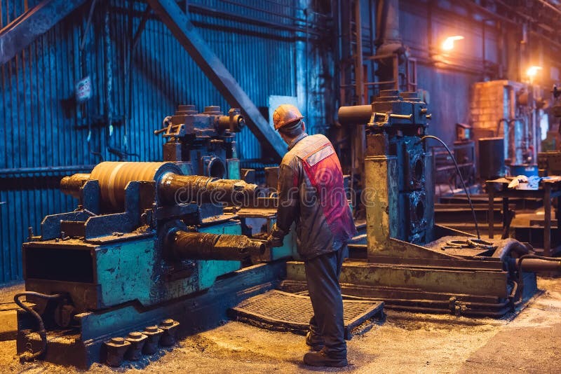 Heavy Industry Worker Working Machine. Rough Industrial Environment ...