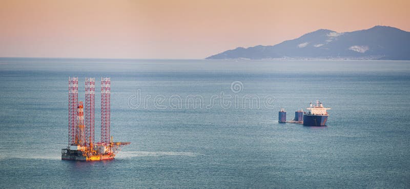 Heavy Lift Cargo Ship and a Jack Up Rig Stock Image - Image of import ...