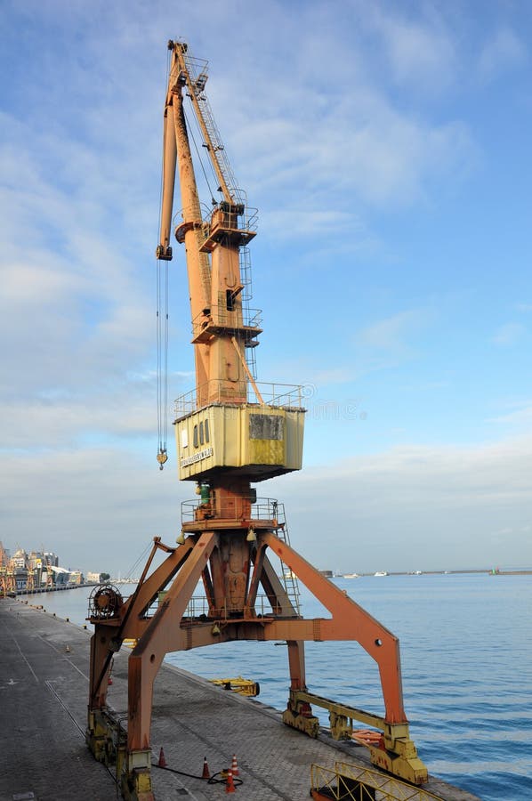 Lifting Crane for Elevating Boat at Harbor Docks. Editorial Stock Image ...