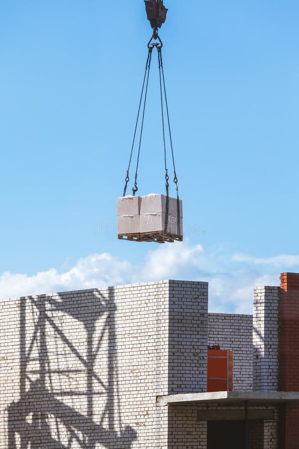Heavy Load Hanging on Construction Site of Brick Building Stock Image ...