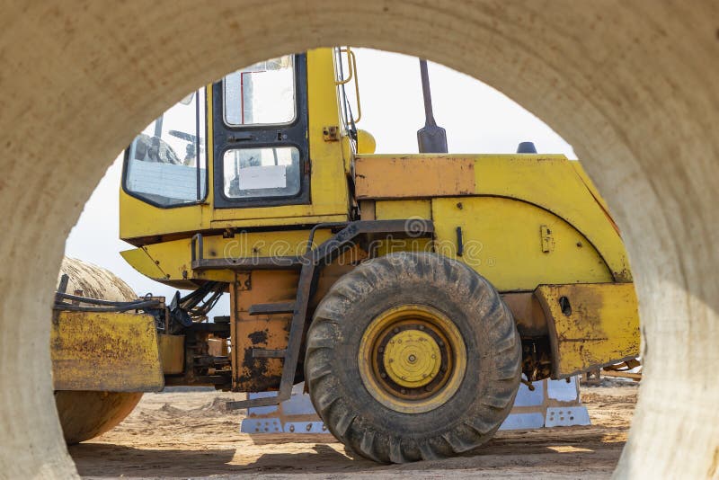Heavy Loader at the Construction Site. View of the Wheel Loader through ...