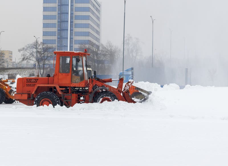 Heavy Machinery Cleaning the Snow after Heavy Snowfall. Season Stock ...