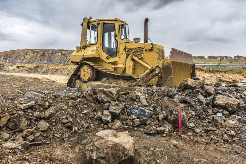 Construction Site with an Excavator Moving Rock Stock Photo - Image of ...