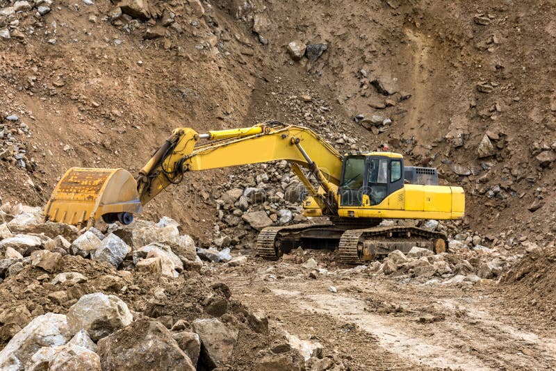 Heavy Machinery Moving Stone and Rock in an Open Mine Stock Image ...