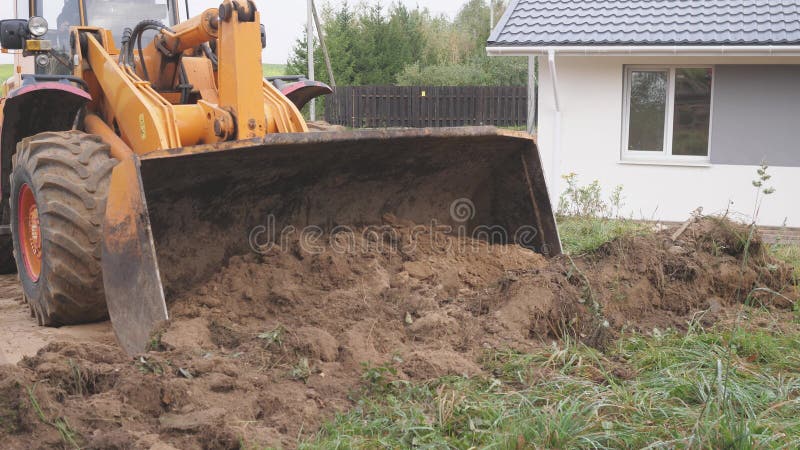 Heavy Machinery Performing the Task of Digging Soil at a Construction ...