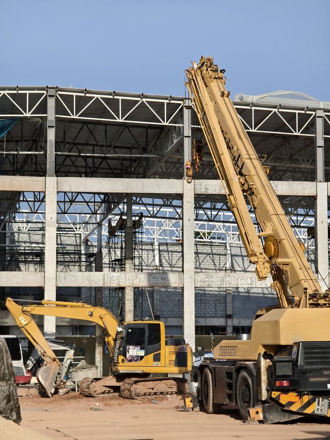 Heavy Machinery and a Tall Crane at the Construction Site Stock Photo ...