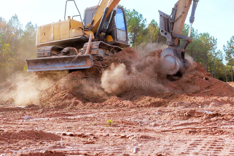 Heavy Machinery Working on Construction Site with Dust Clouds in ...