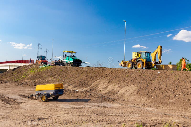 Heavy Mechanization on Construction Site. Tarmac Road Laying Machine ...