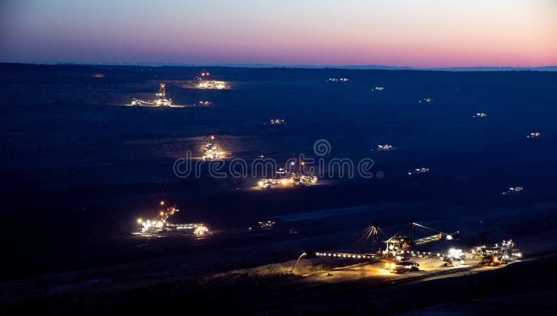Heavy Mining Equipment at Work in an Open-pit Mine at Dusk Editorial ...