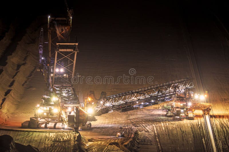 Heavy Mining Equipment at Work in an Open-pit Mine at Dusk Stock Photo ...