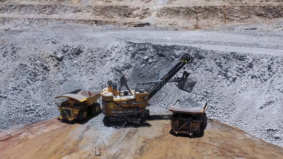 Heavy Mining Machinery Extracting Minerals in an Open Pit Mine Stock ...