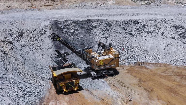 Heavy Mining Machinery Extracting Minerals in an Open Pit Mine Stock ...
