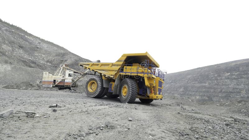 Heavy Mining Trucks Moving on a Limestone Quarry. Heavy Equipment ...