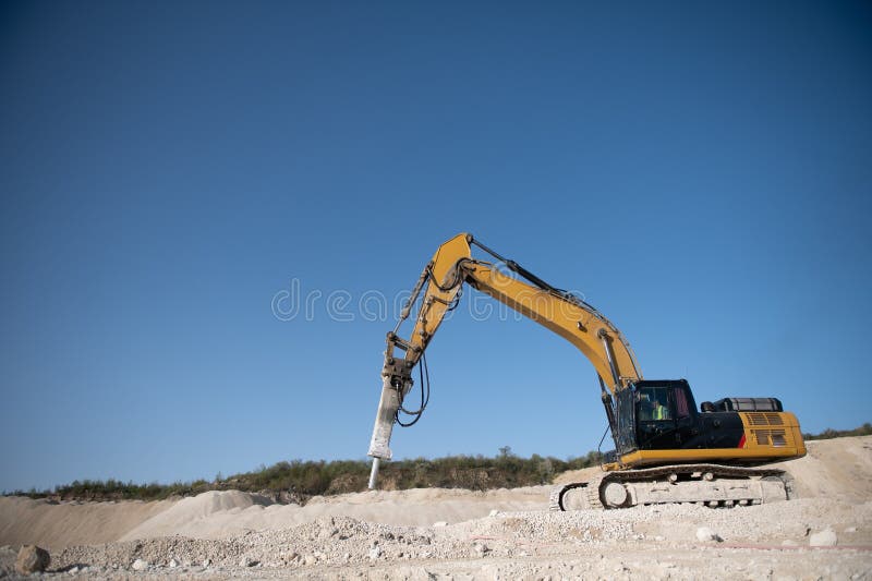 Heavy Organge Excavator with Shovel Standing on Hill with Rocks Stock ...