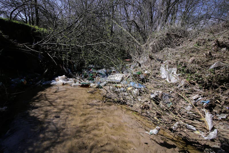 Heavy Polluted Water Stream with Domestic Garbage Editorial Photography ...
