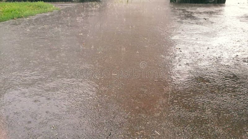 Heavy Pouring Rain in the City. Raindrops Fall on the Sidewalk. Heavy ...