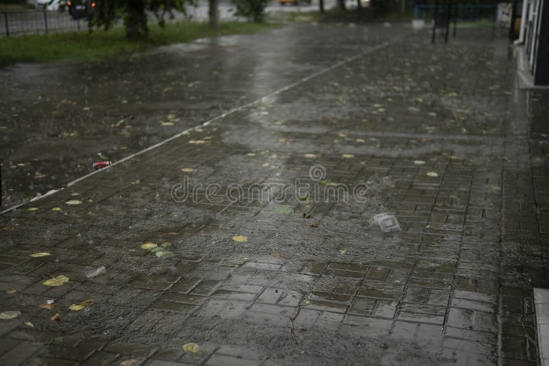 Heavy Rain Drops Falling on City Street Stock Image - Image of outdoor ...