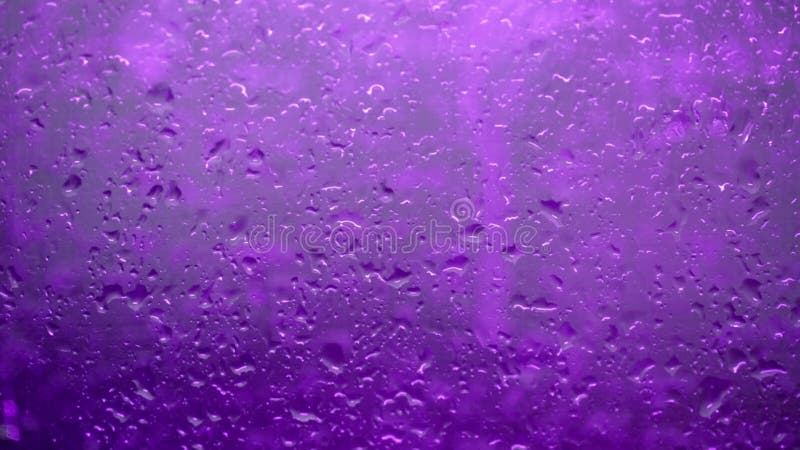 Heavy Rain and Drops Flow Down the Window Glass in the Evening ...