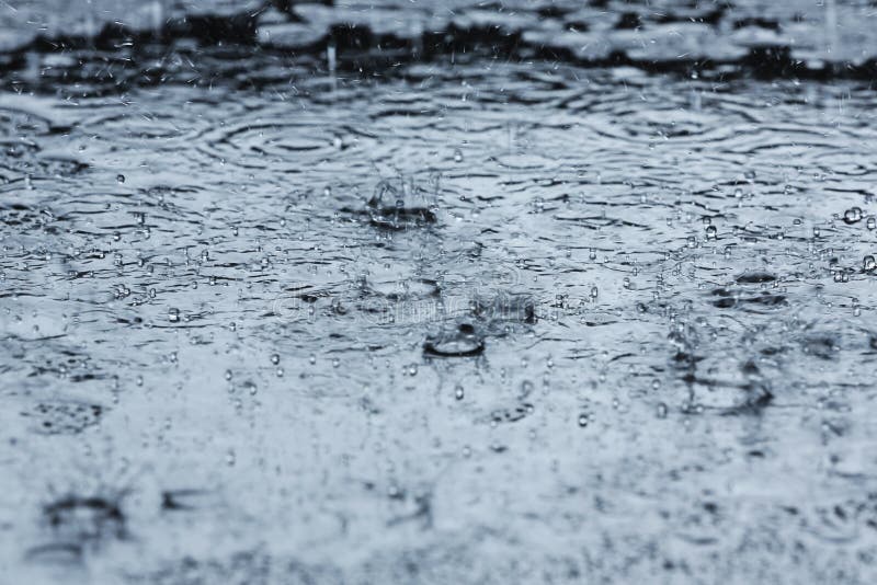 Heavy Rain Falling Down into Puddle Stock Image - Image of cold, fall ...