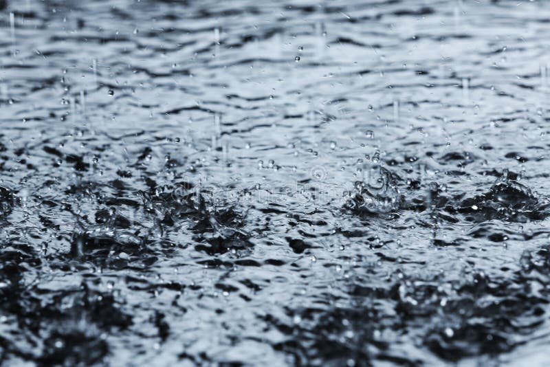 Heavy Rain Falling Down into Puddle Stock Photo - Image of falling ...