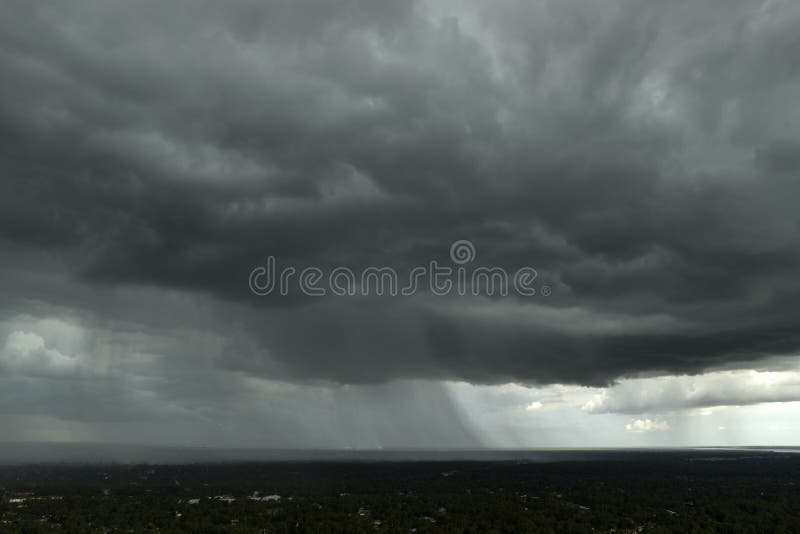 Heavy Rain Falling Down from Stormy Clouds during Thunderstorm on Dark Sky. Moving and Changing ...