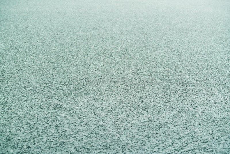 Rain Hitting the Water Surface Stock Image - Image of rainy, splashing ...