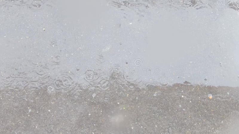 Heavy rain on the pavement stock footage. Video of outdoor - 153294554