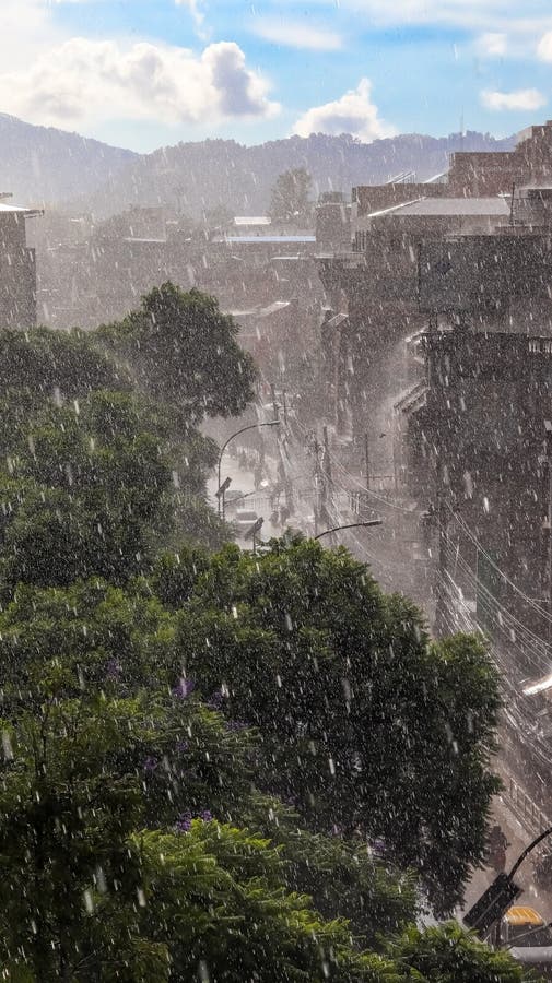 Heavy Rain Storm with Blue Sky in the Backdrop Stock Photo - Image of ...