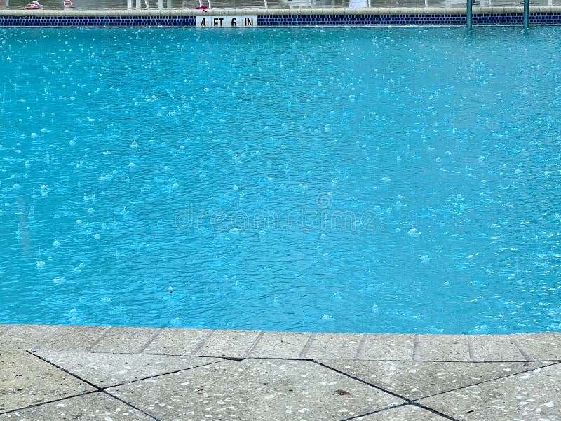 Raining on Swimming Pool stock image. Image of storm - 253765707