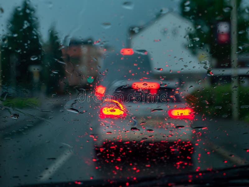 Heavy Rain on the Windshield with Brake Light Stock Image - Image of ...