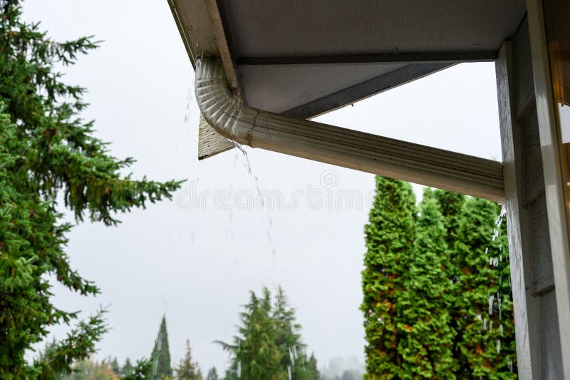 Heavy Rainfall Overflowing Roof Gutter and Not Going Down the Downspout ...