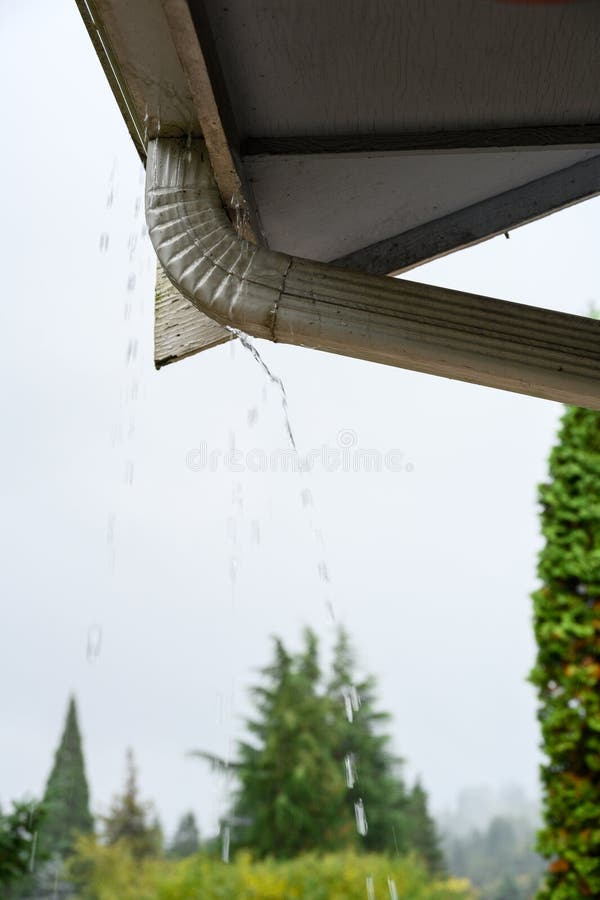 Heavy Rainfall Overflowing Roof Gutter and Not Going Down the Downspout ...