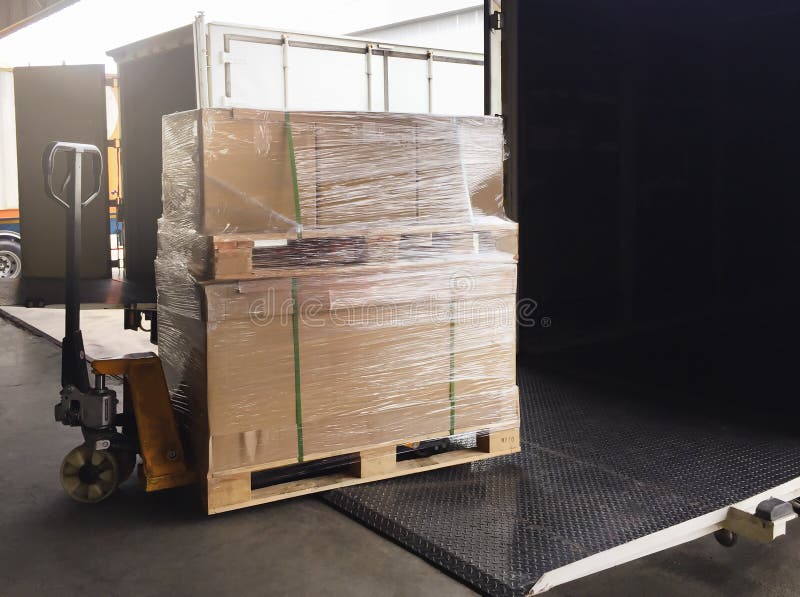 Heavy Shipment Box Loading into Cargo Container. Truck Parked Loading ...