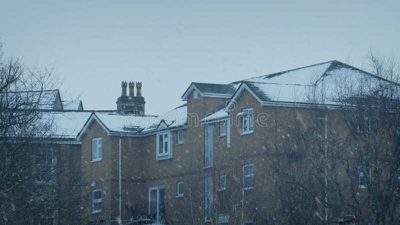 Apartment Building with Snow Falling in Winter Stock Footage - Video of ...