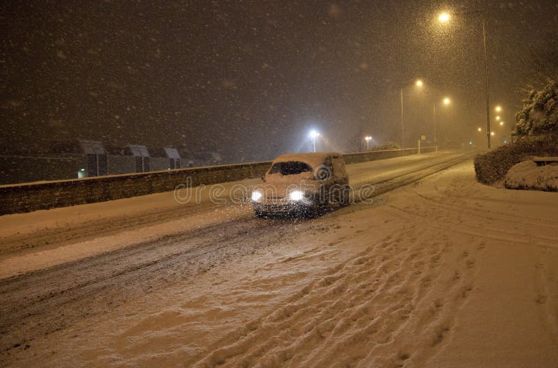 Heavy Snow Fall with Passing Traffic Stock Photo - Image of snow, town ...