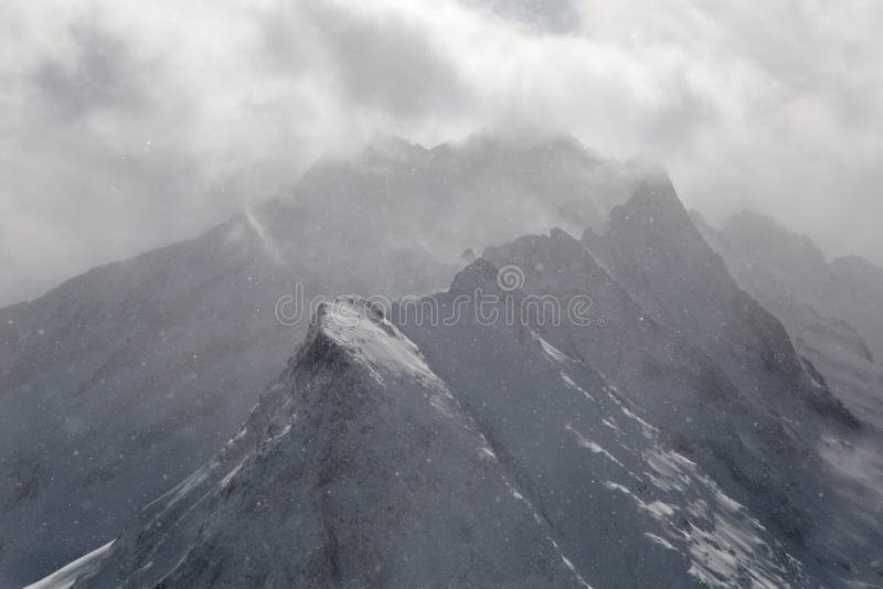 Heavy snowfall in the ALps stock photo. Image of range - 81351460