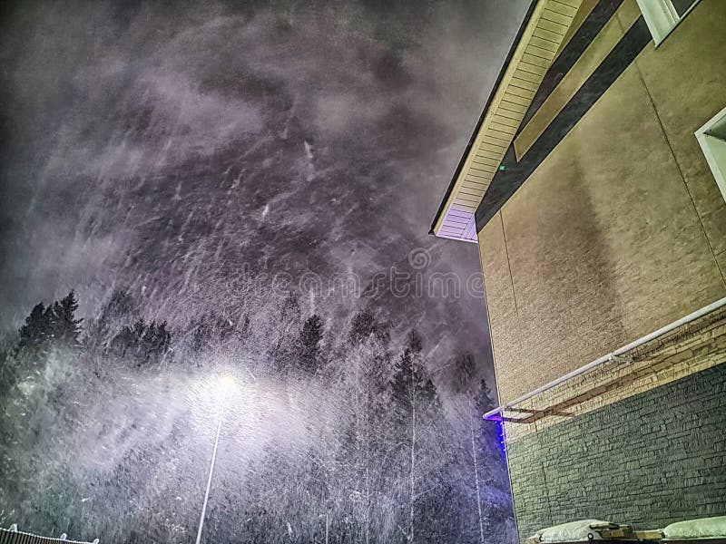 Heavy Snowfall Blankets a Historic Building at Night during a Winter ...