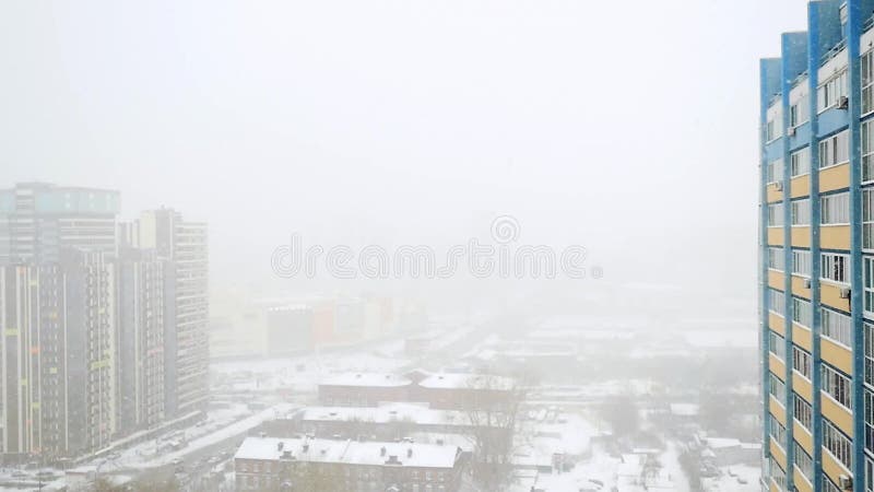 Heavy Snowfall in the City in Slowmotion. Streets, Houses and Machine ...