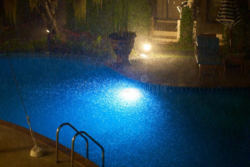 A Heavy Tropical Downpour in the Courtyard of the Condo at Night Floods ...