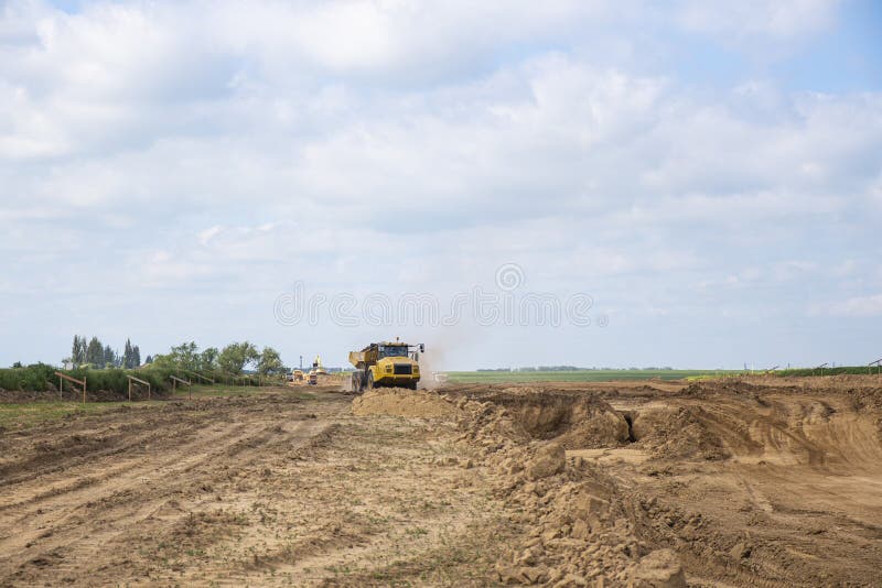 A Heavy Truck on a New Highway Construction Stock Photo - Image of ...