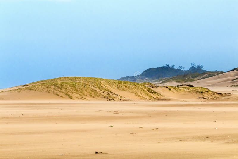 Heavy Wind Blowing Sand on Beach Against Coastal Skyline Stock Image ...
