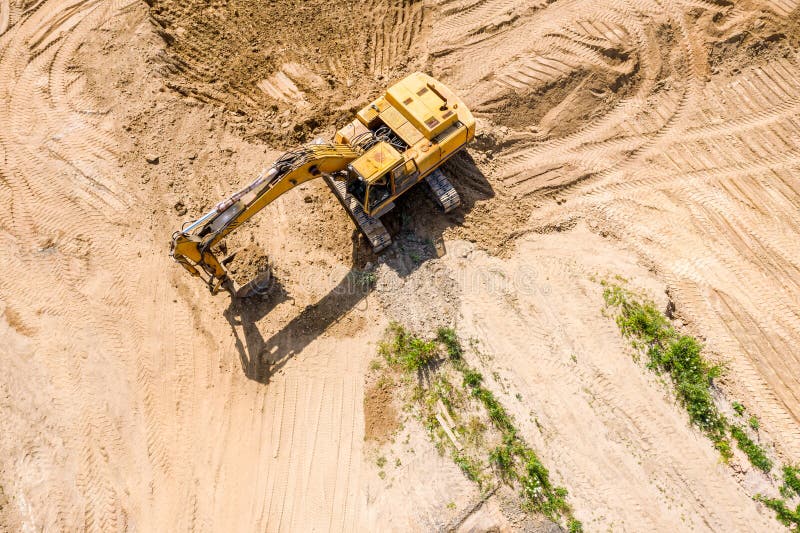 Heavy Yellow Excavator Moving Ground at Construction Site Stock Image ...