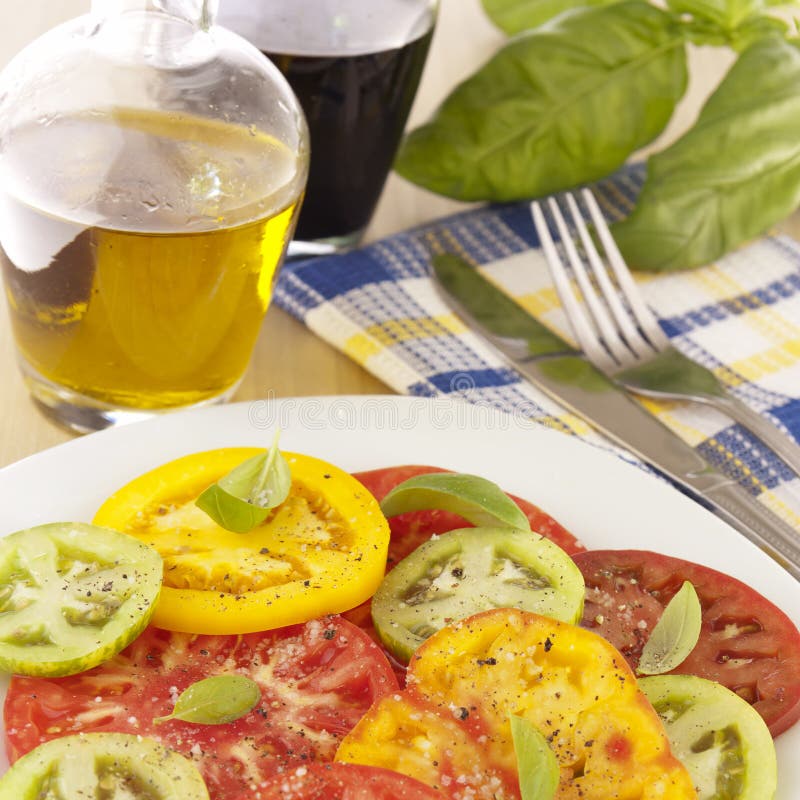 Heirloom tomatoes salad stock image. Image of knife, appetizer - 26068965