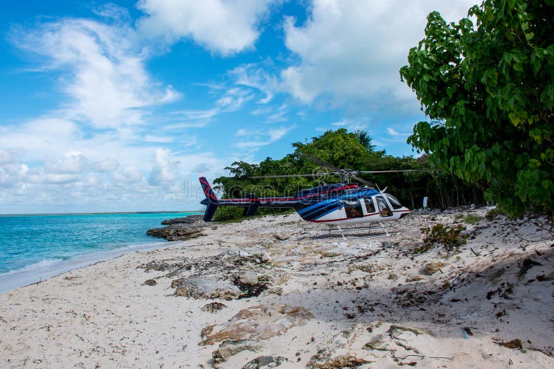 Helicopter on the Beach on Tree and Beautiful Ocean and Clouds at ...