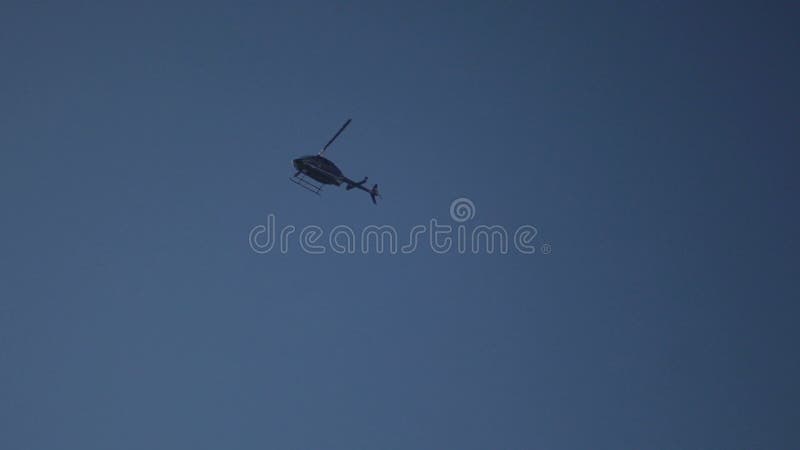 Helicopter Chopper at Blue Sky with Light Rays. Slow Motion Fast ...