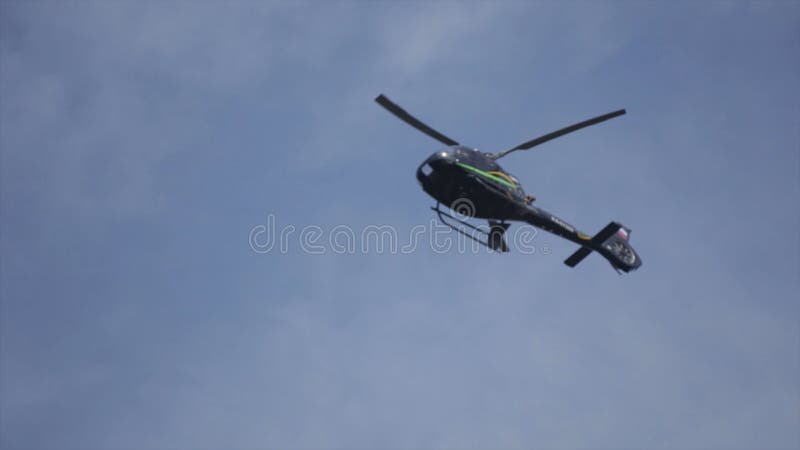 Helicopter in the Cloudy Sky with Lightning. Helicopter from Below ...