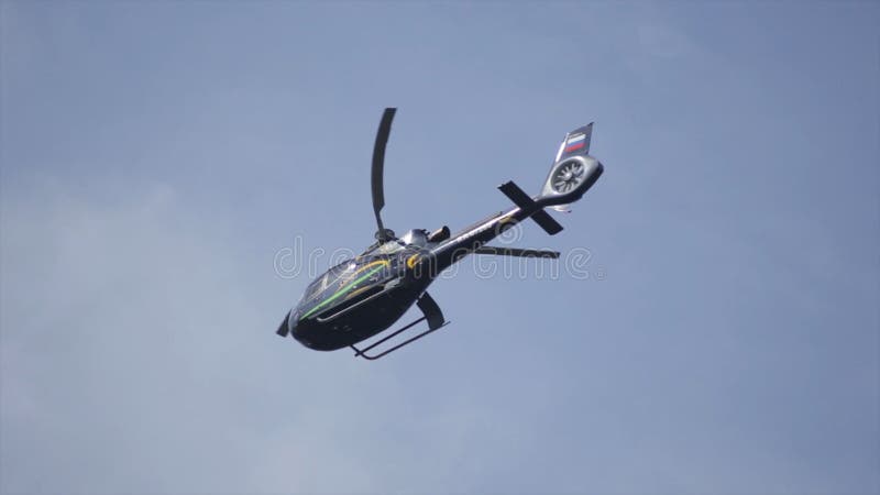 Helicopter in the Cloudy Sky with Lightning. Helicopter from Below ...