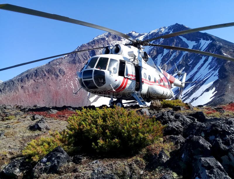 Helicopter on the Crest of a Volcano Stock Photo - Image of cloud ...