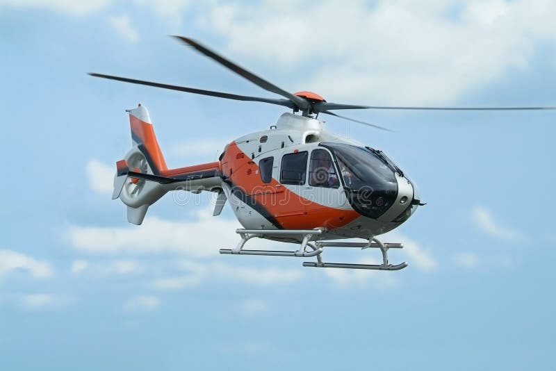 Helicopter flying stock photo. Image of cockpit, orange - 4789620