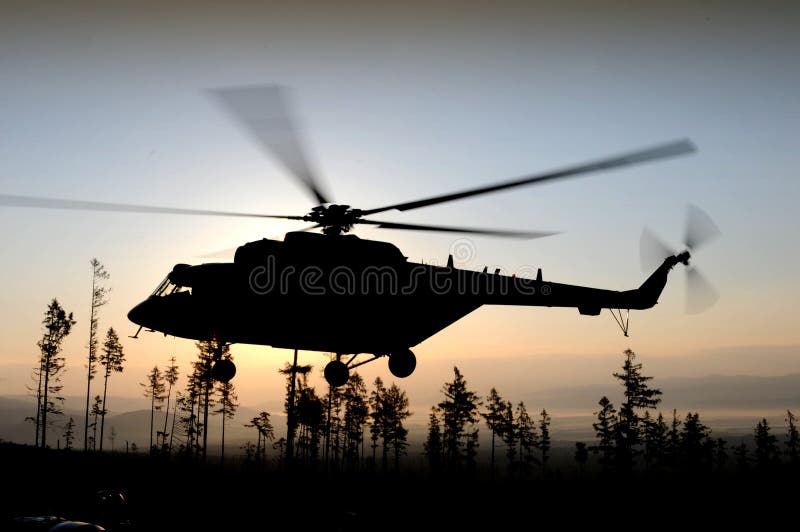 Helicopter flying at night stock image. Image of sunset - 35579711